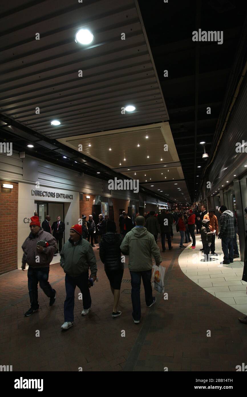 Fans make their way around the concourses at Old Trafford Stock Photo ...