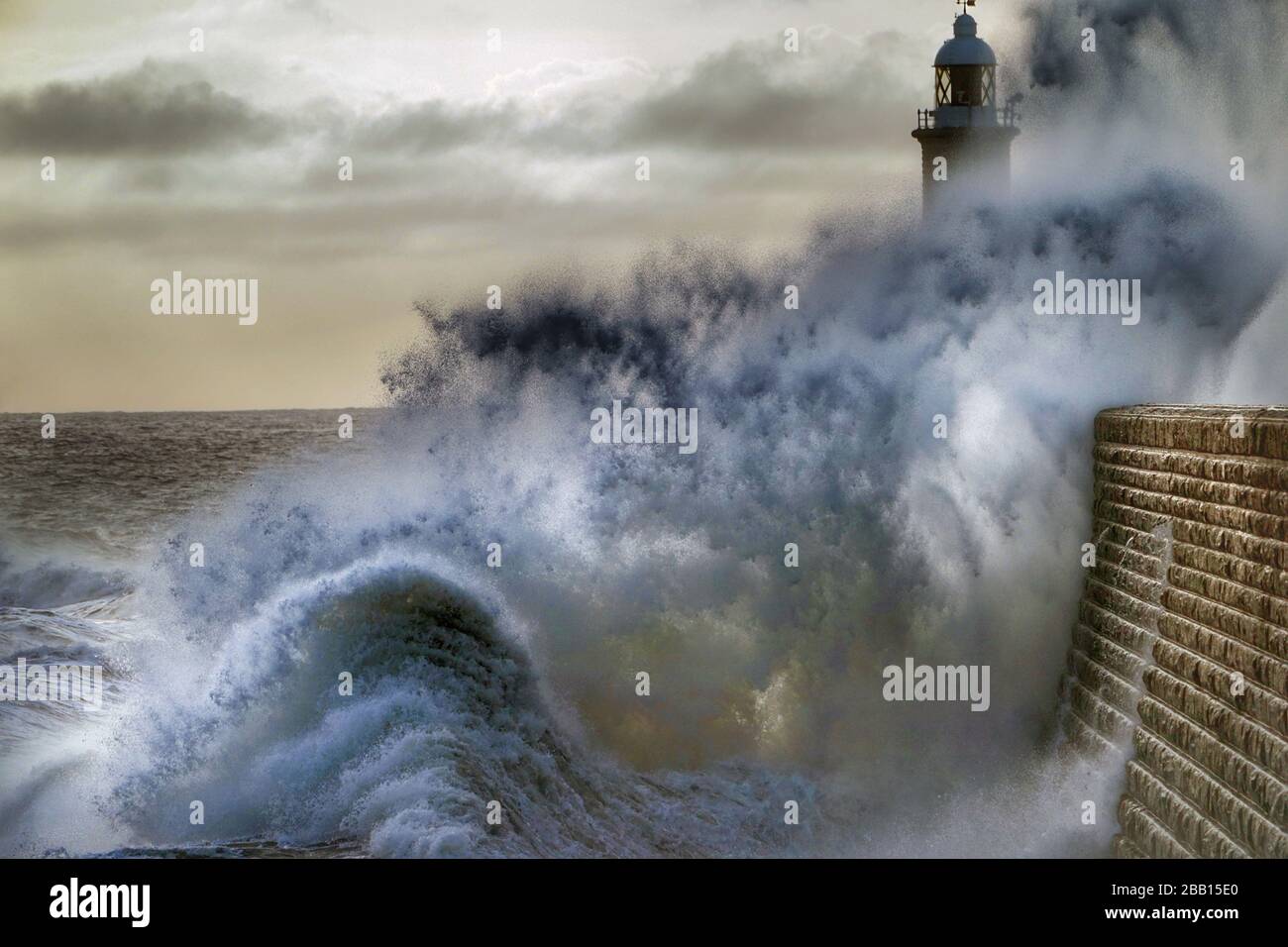 Waves break against pier tynemouth hi-res stock photography and images ...
