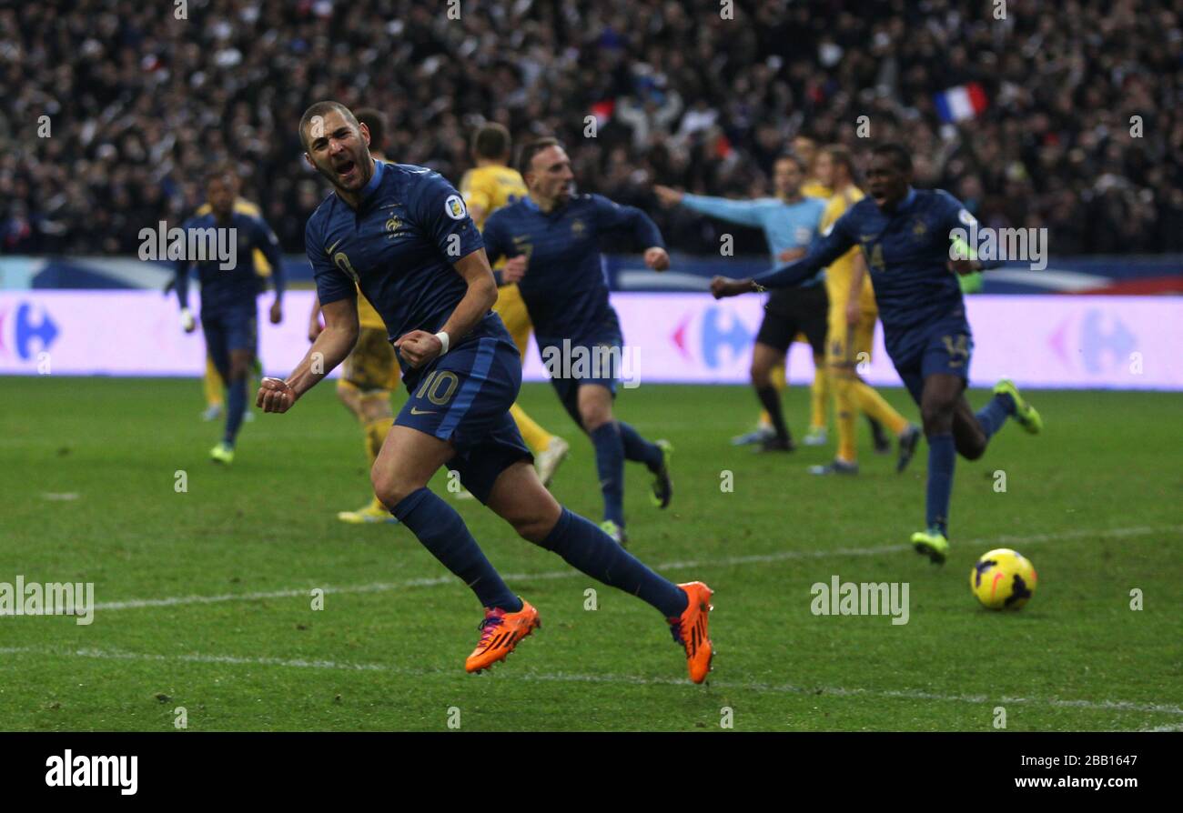 France's Karim Benzema celebrates scoring the opening goal of the game ...