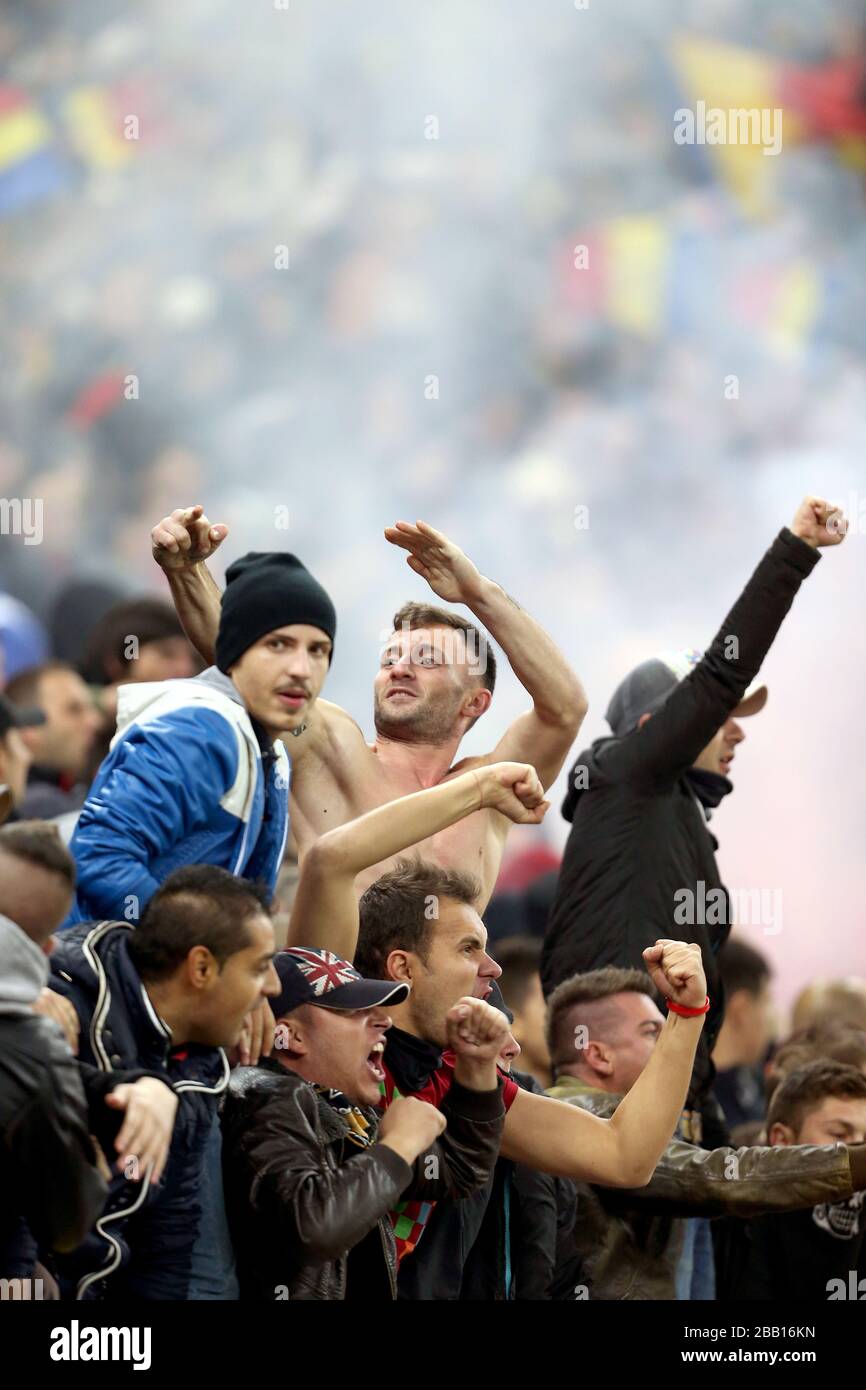 Romania fans soak up the atmosphere Stock Photo - Alamy