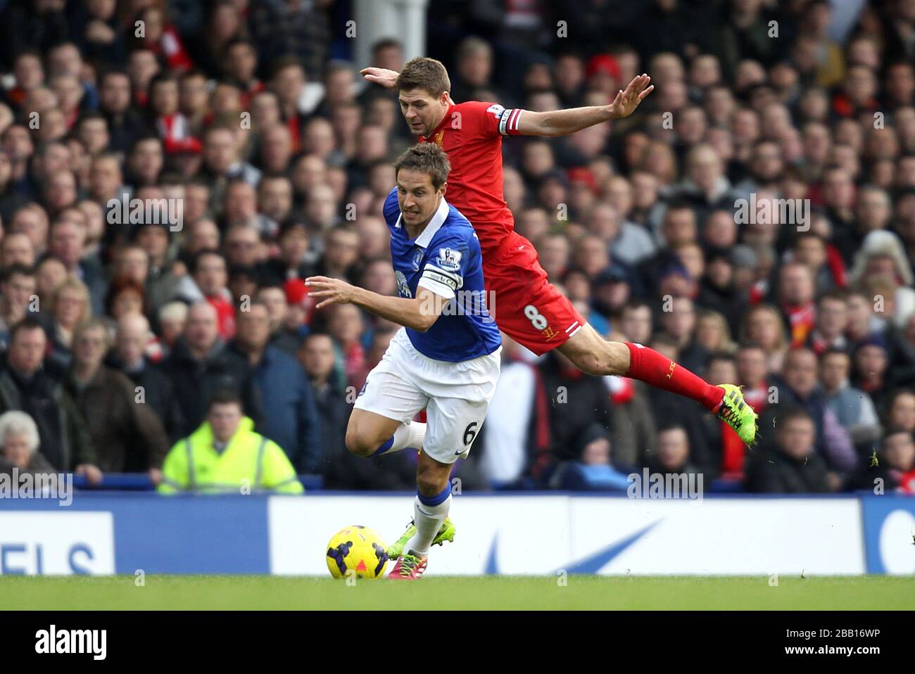 Liverpool's Steven Gerrard and Everton's Phil Jagielka (left) battle ...