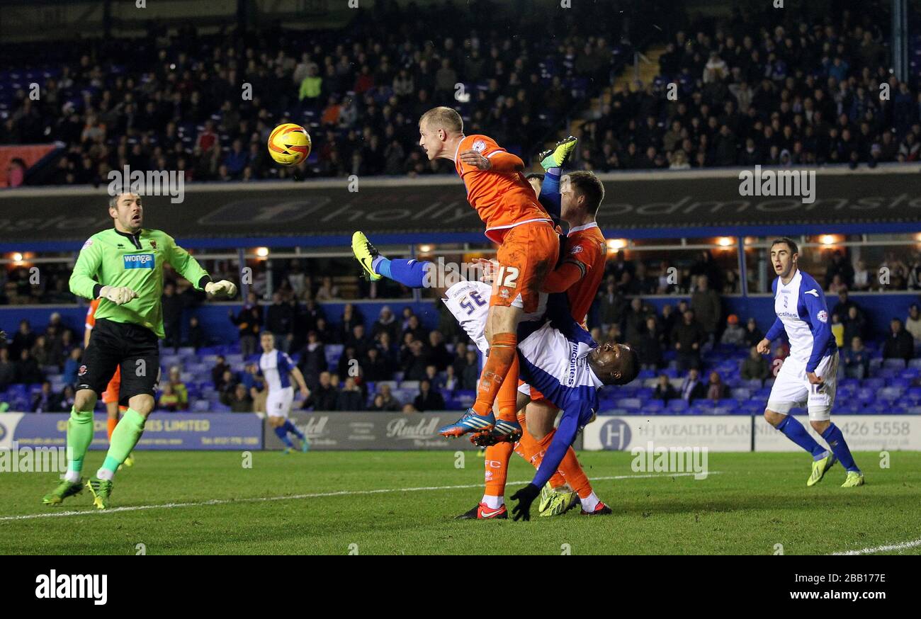 Birmingham City's Aaron McLean and Blackpool's Neal Bishop (top) battle ...