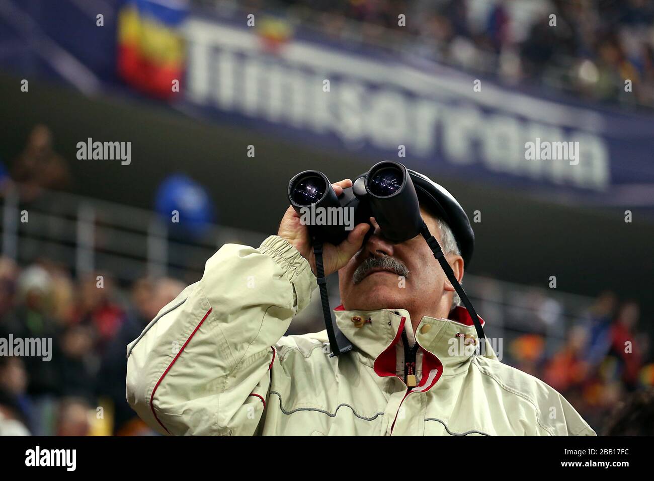 A fan with a pair of binoculars Stock Photo - Alamy