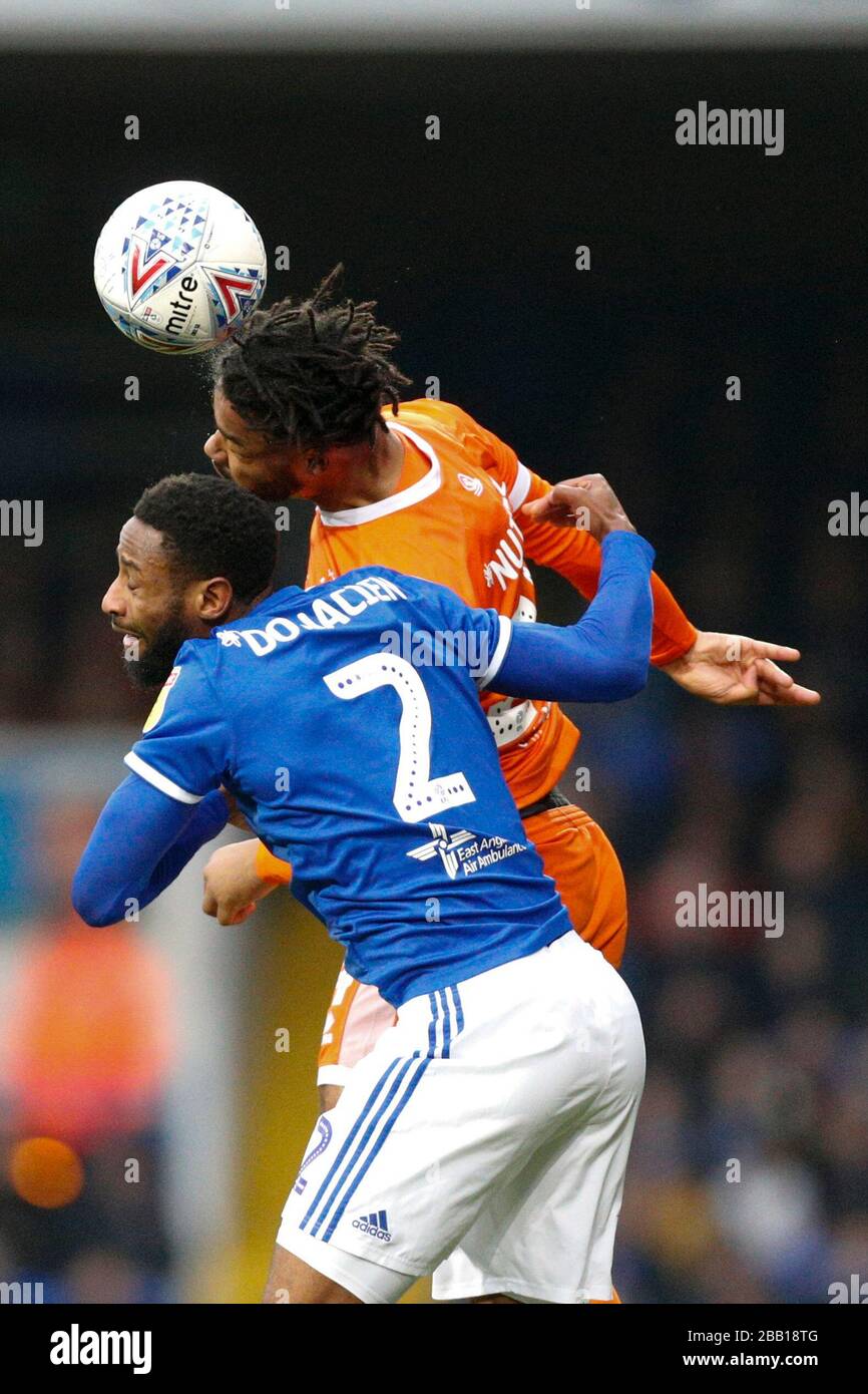 Ipswich Town's Janoi Donacien (left) and Blackpool's Joe Nuttall battle ...