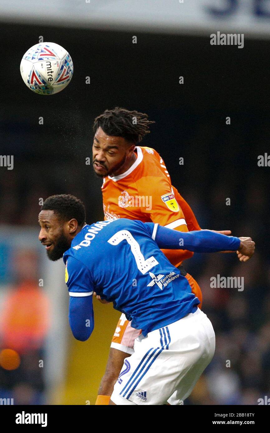 Ipswich Town's Janoi Donacien (left) and Blackpool's Joe Nuttall battle ...
