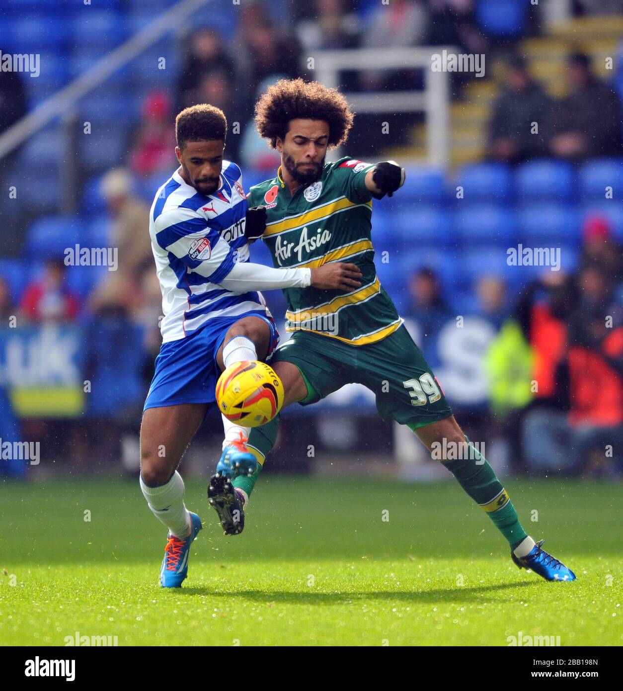 Reading's Garath McCleary (left) & QPR's Benoit Assou-Ekotto challenge ...