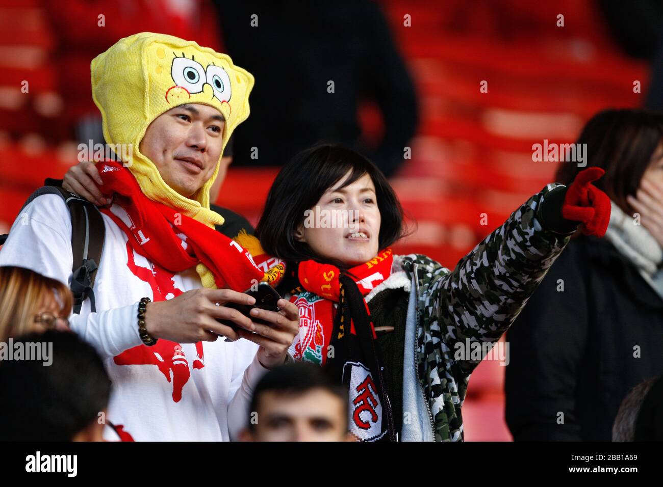 Liverpool fans in the stands Stock Photo - Alamy