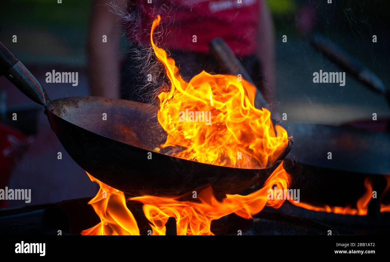 Cooking on gas stove street hi-res stock photography and images - Alamy