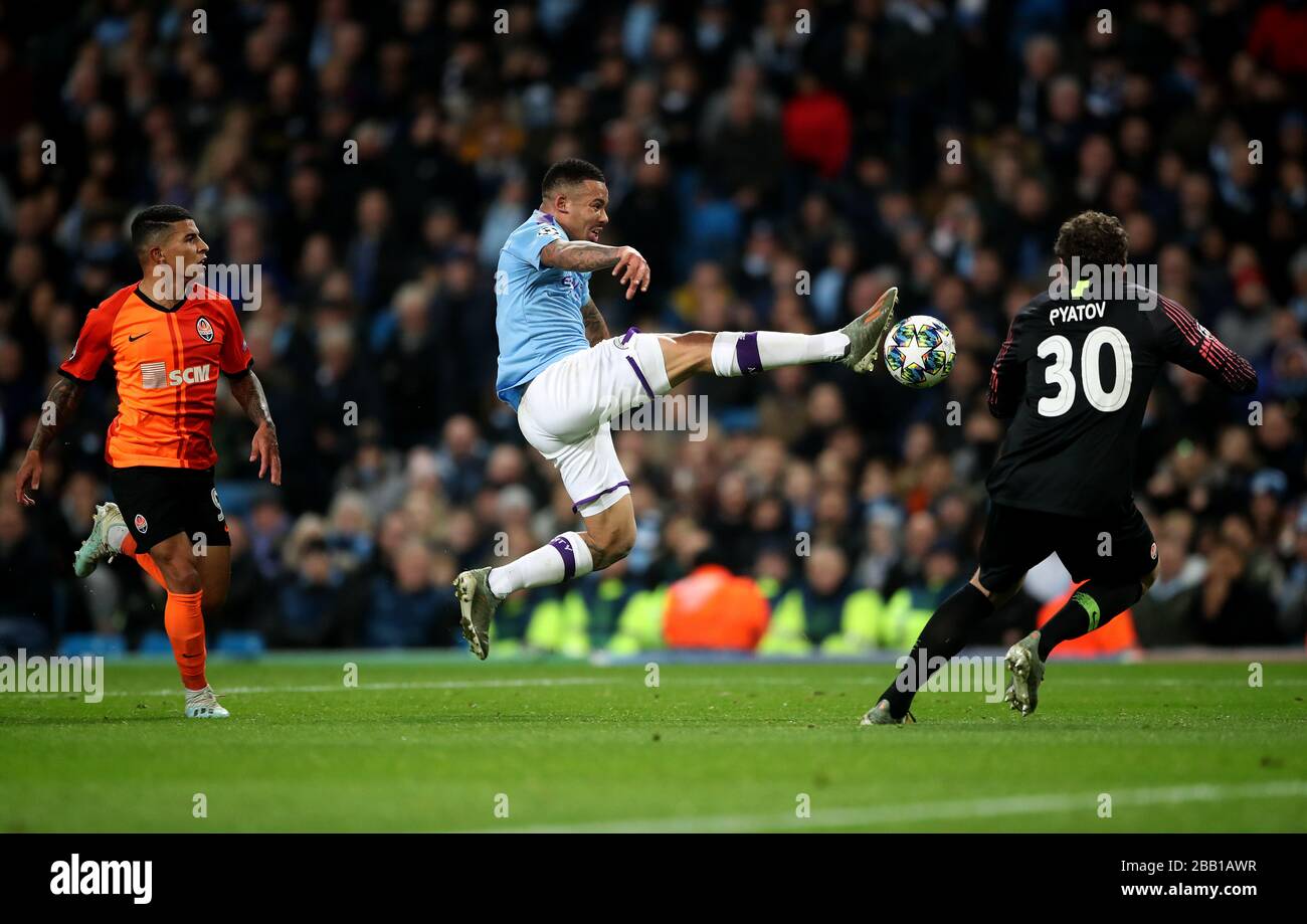 Manchester City's Gabriel Jesus (centre) has a shot on goal, under ...