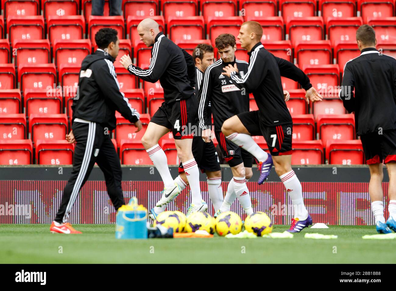 Fulham players warm up before the Barclays Premier League match ...