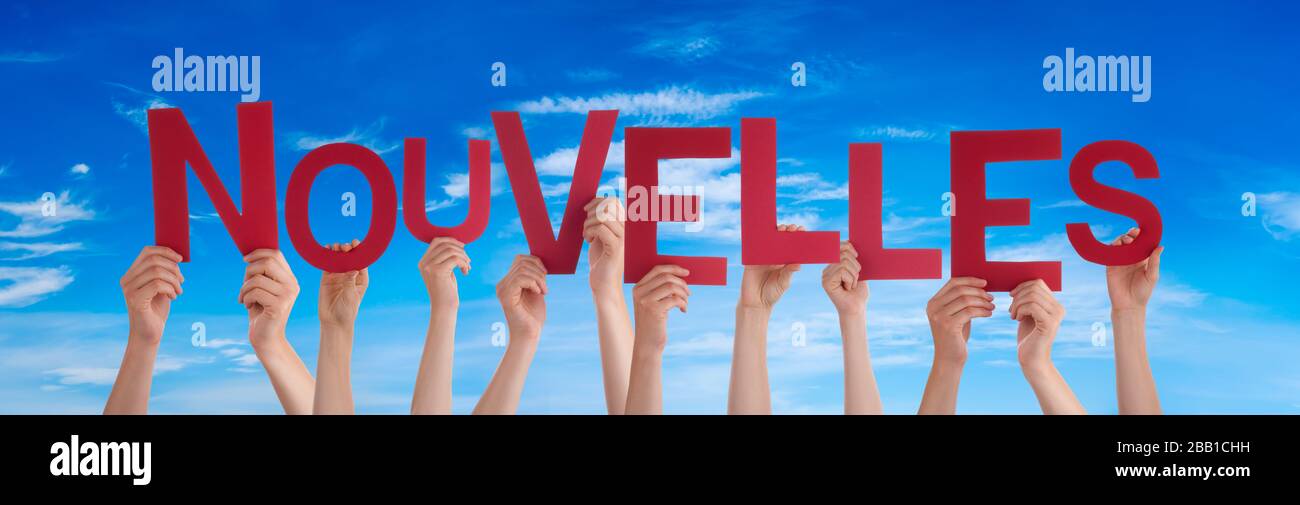 People Hands Holding Word Nouvelles Means News, Blue Sky Stock Photo ...