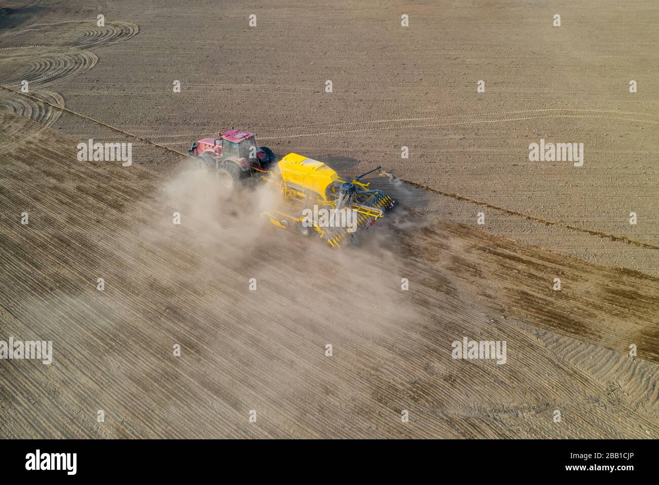Top view of tractor planting corn seed in field, high angle view drone ...