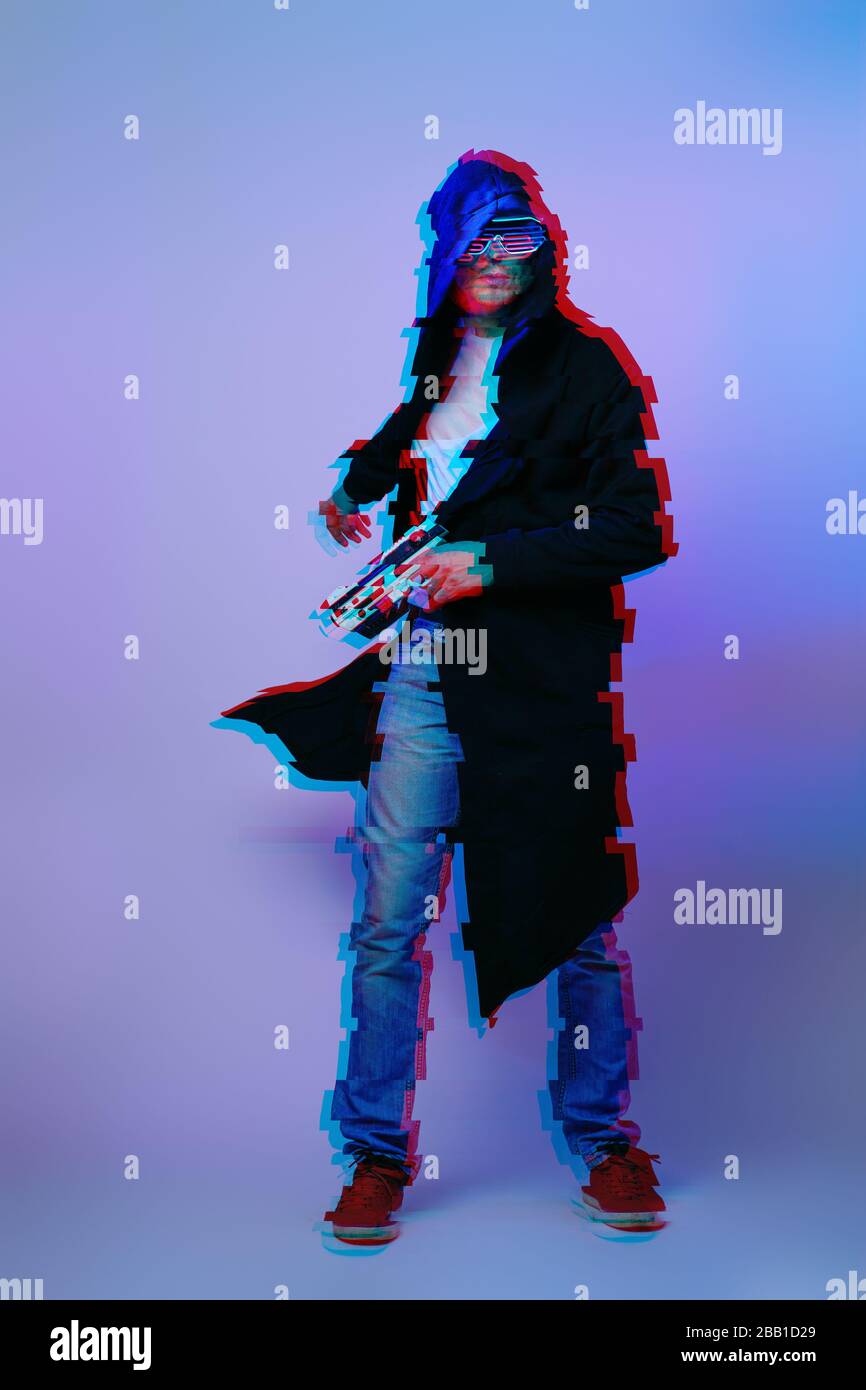 Man with blaster in the futuristic battle. Concept virtual reality ...