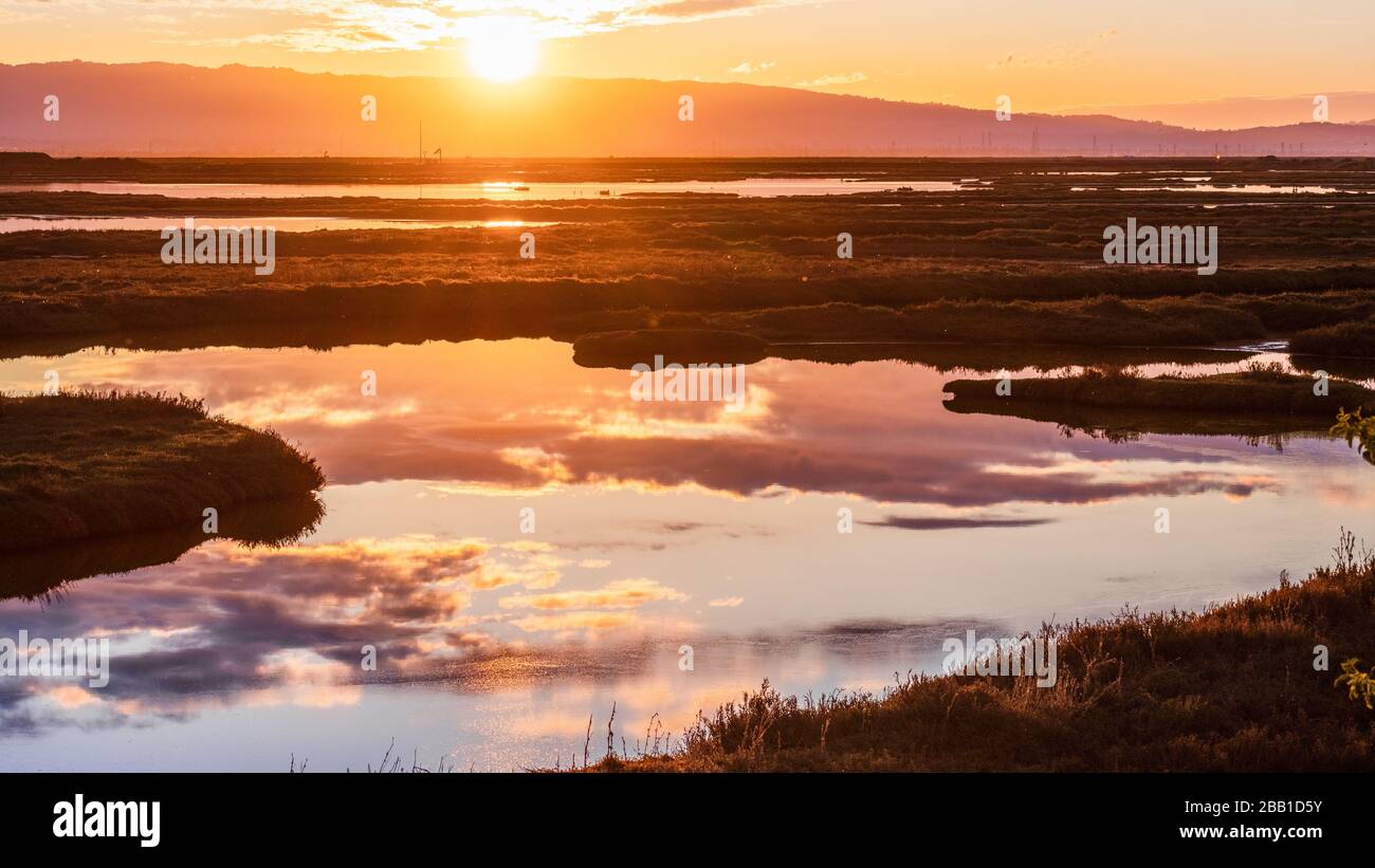 Sunset views of the tidal marshes of Alviso with colorful clouds ...