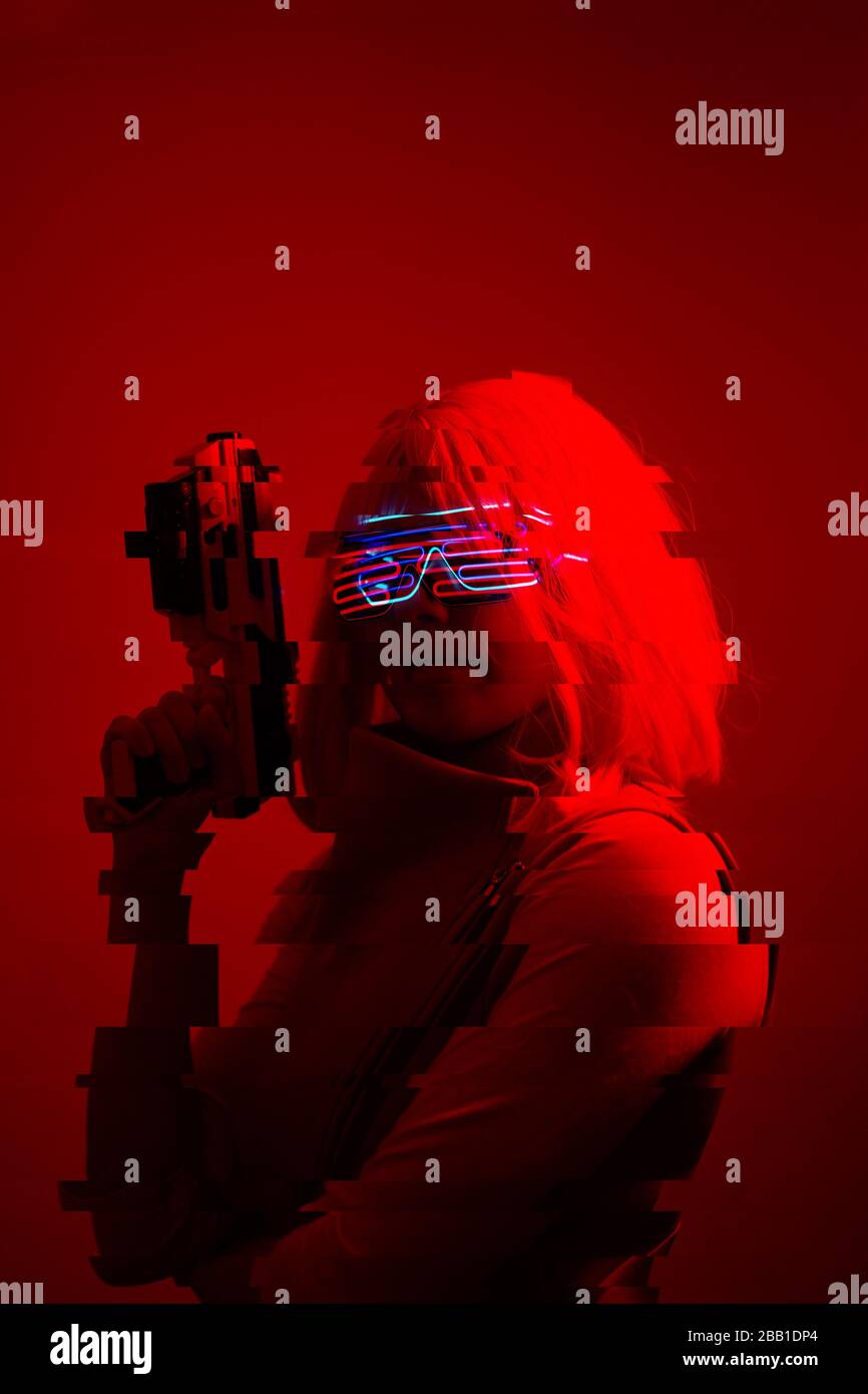Girl with blaster in the futuristic battle. Concept virtual reality ...