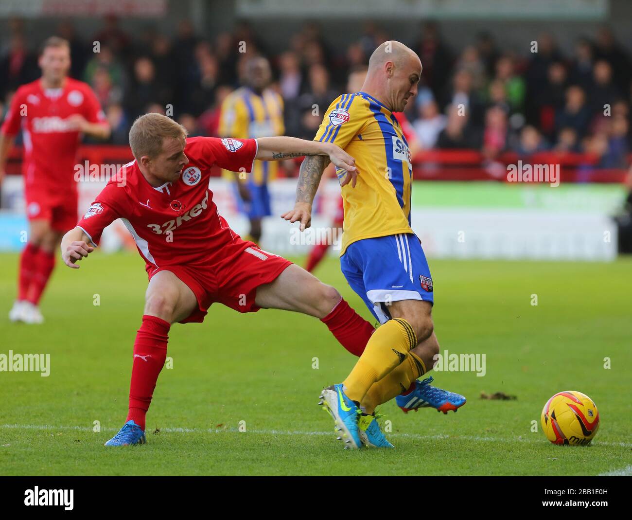 Crawley Town's Nicky Adams (left) challenges Brentford's Alan McCormack Stock Photo - Alamy