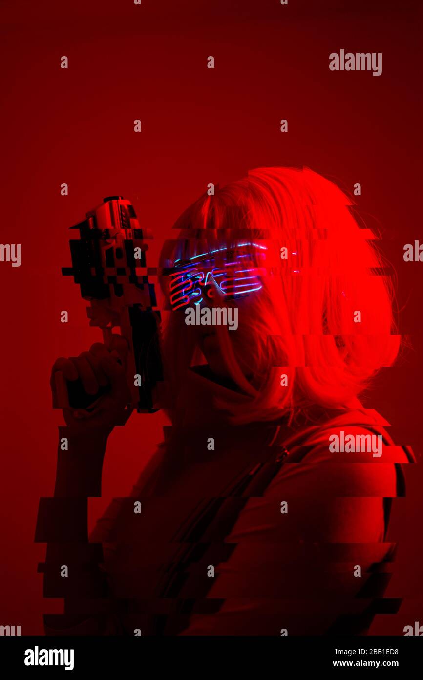 Girl with blaster in the futuristic battle. Concept virtual reality ...