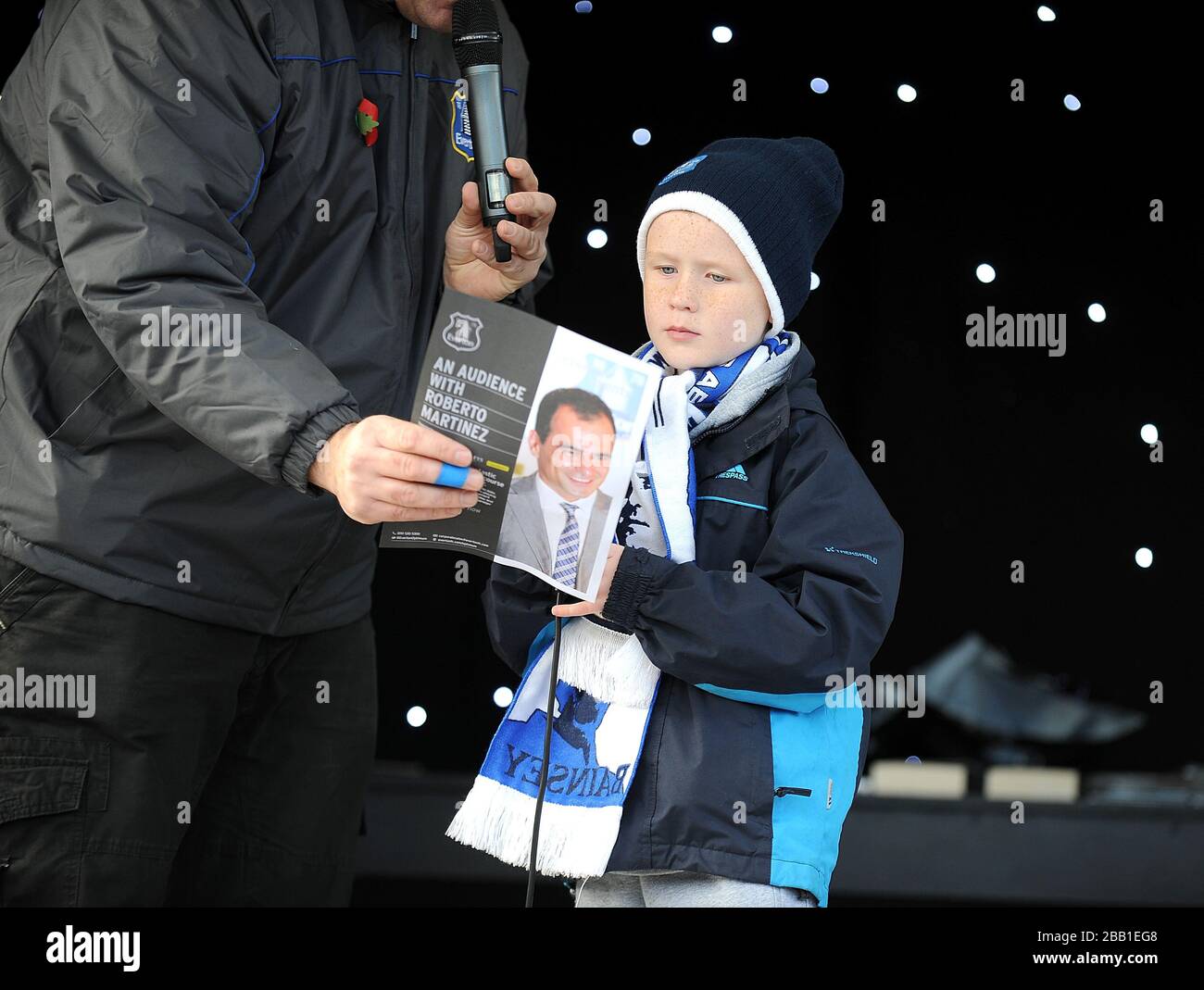 A young Everton fan on stage in the Everton Fan Zone Stock Photo - Alamy