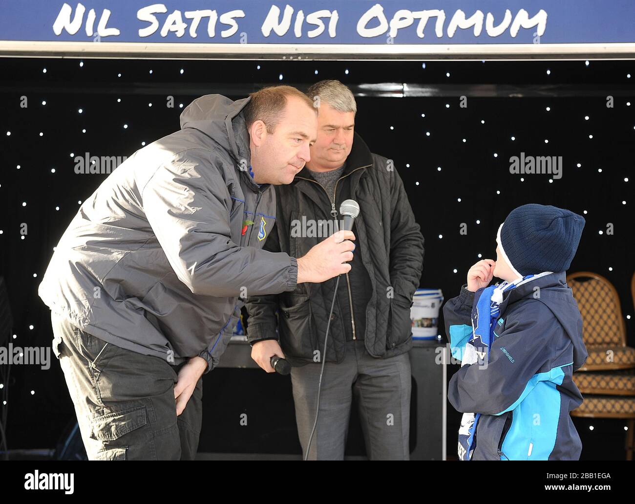 A young Everton fan on stage in the fan zone before kick-off Stock ...