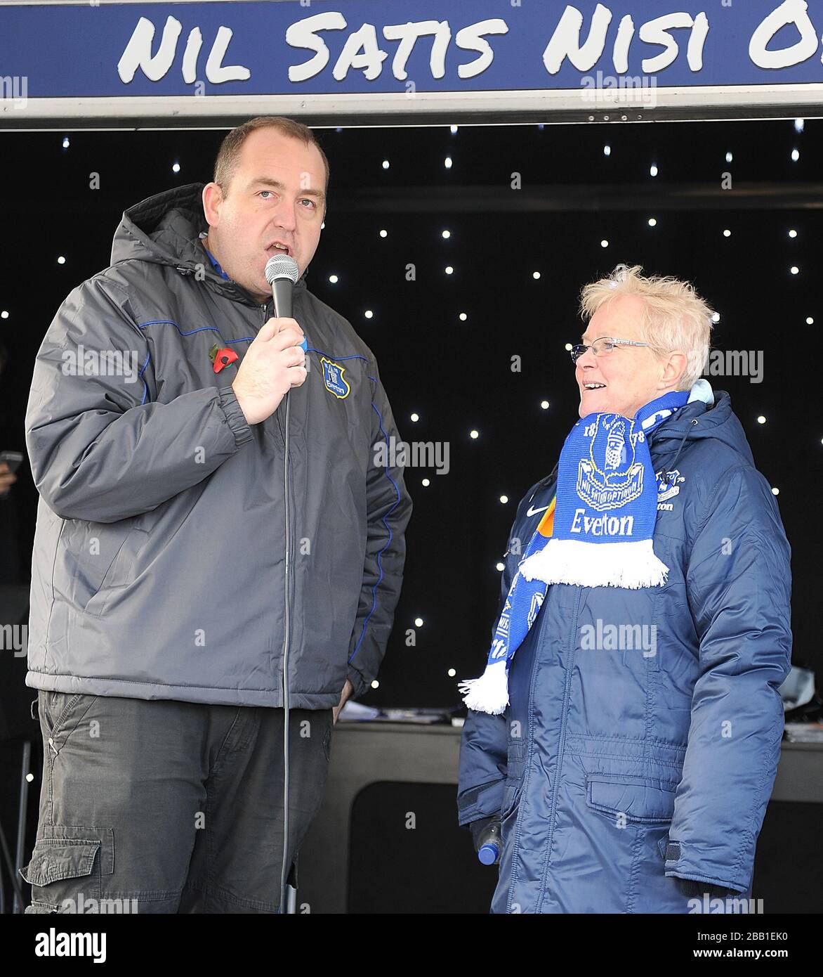 An Everton fan on stage in the fan zone before kick-off Stock Photo - Alamy