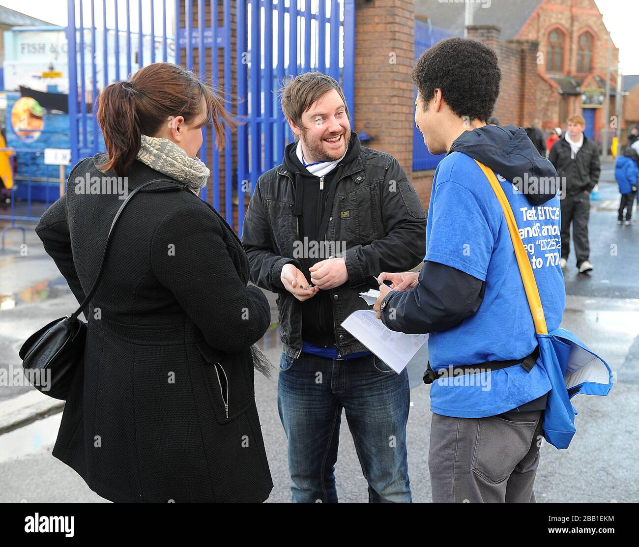 Everton staff help fans outside Goodison Park before kick-off Stock ...