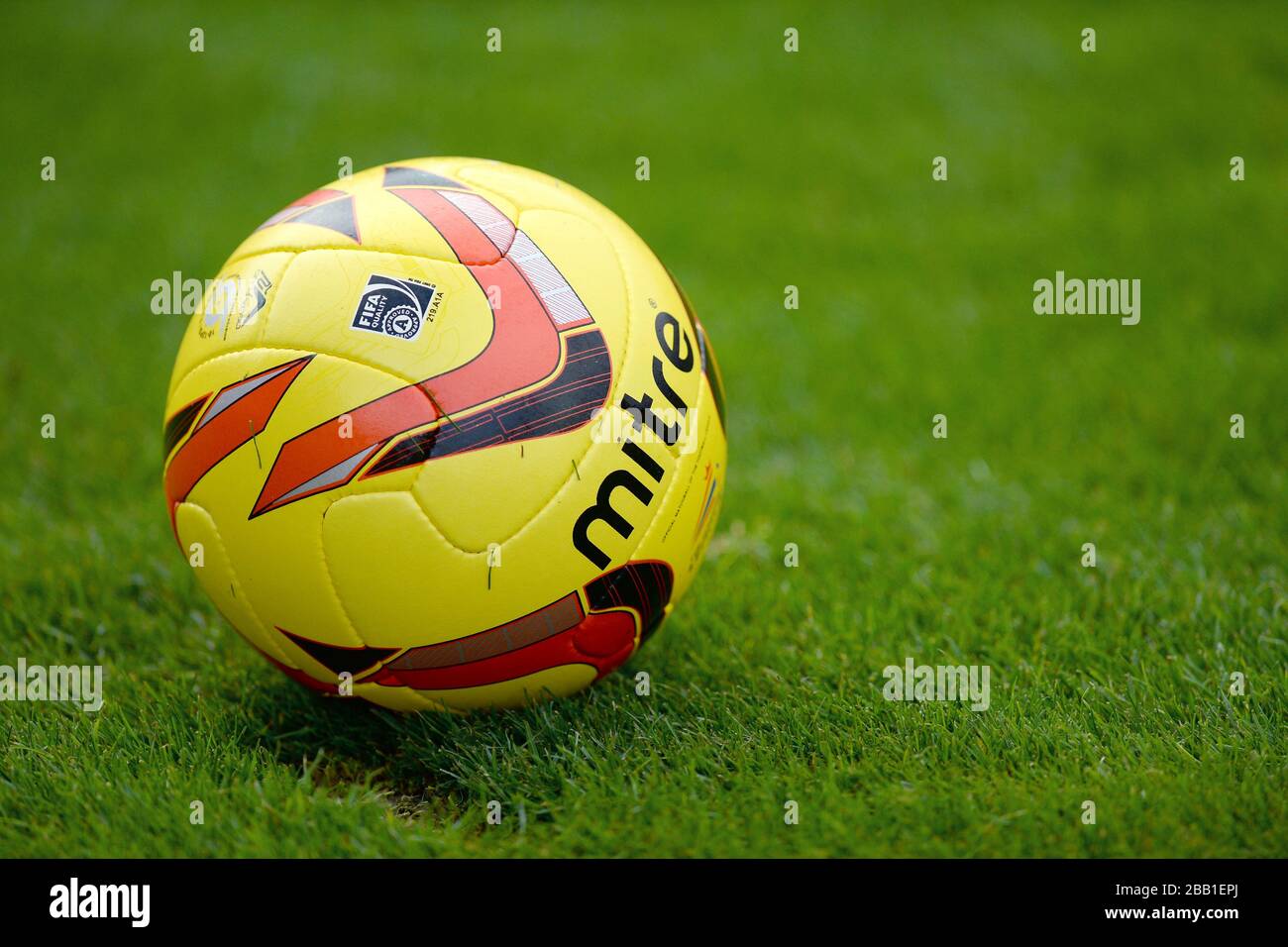 A yellow Mitre football during play Stock Photo - Alamy