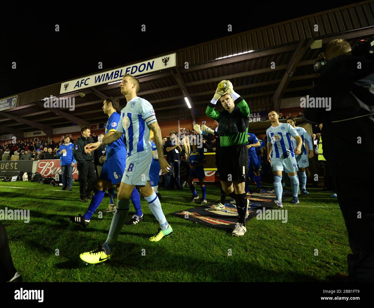 Coventry City captain Carl Baker leads his team out to face Wimbledon ...