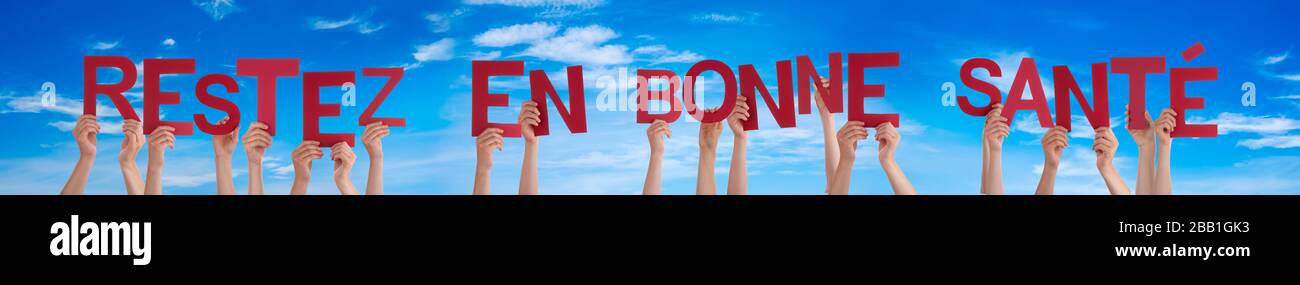 People Hands Holding Word Restez En Bonne Sante Means Stay Healthy ...