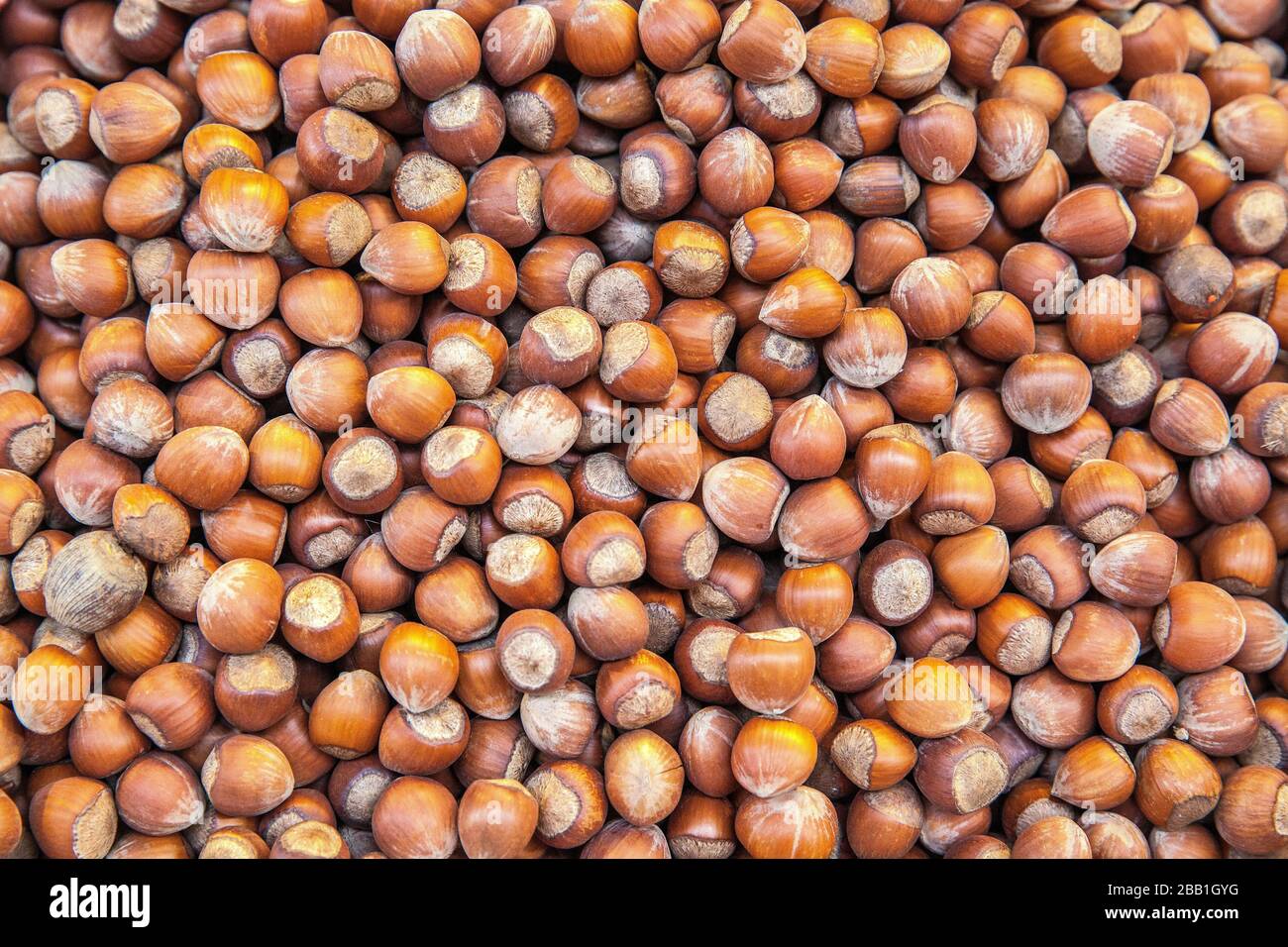 the background consisting of a set of small beautiful nuts Stock Photo ...