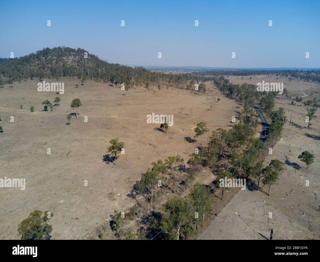 Aerial of native vegetation lining road into Abercorn Queensland ...