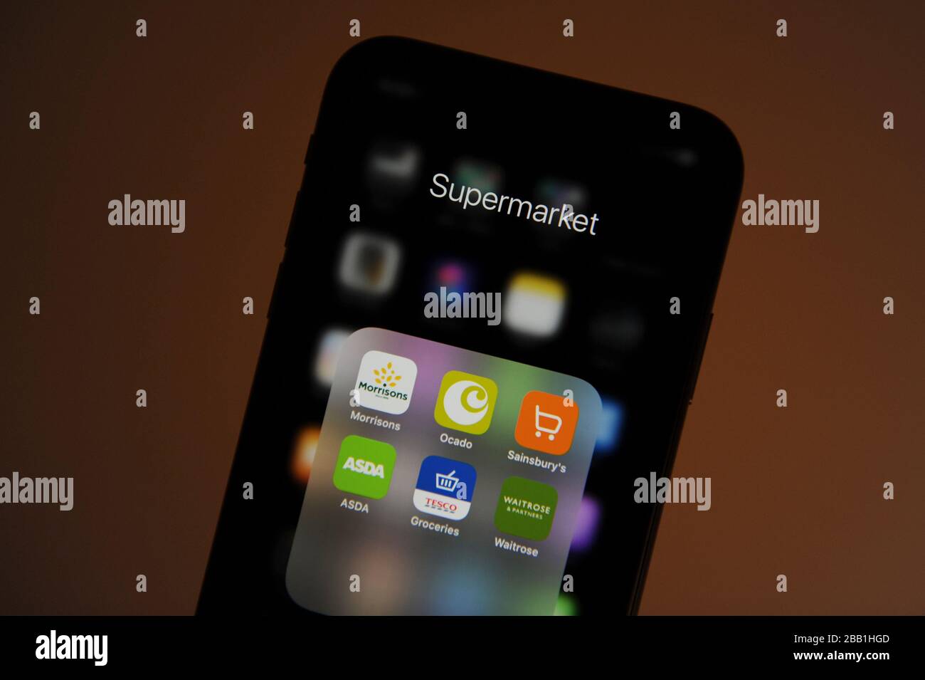 Generic UK Supermarket apps are seen on an iphone, from left to right ...