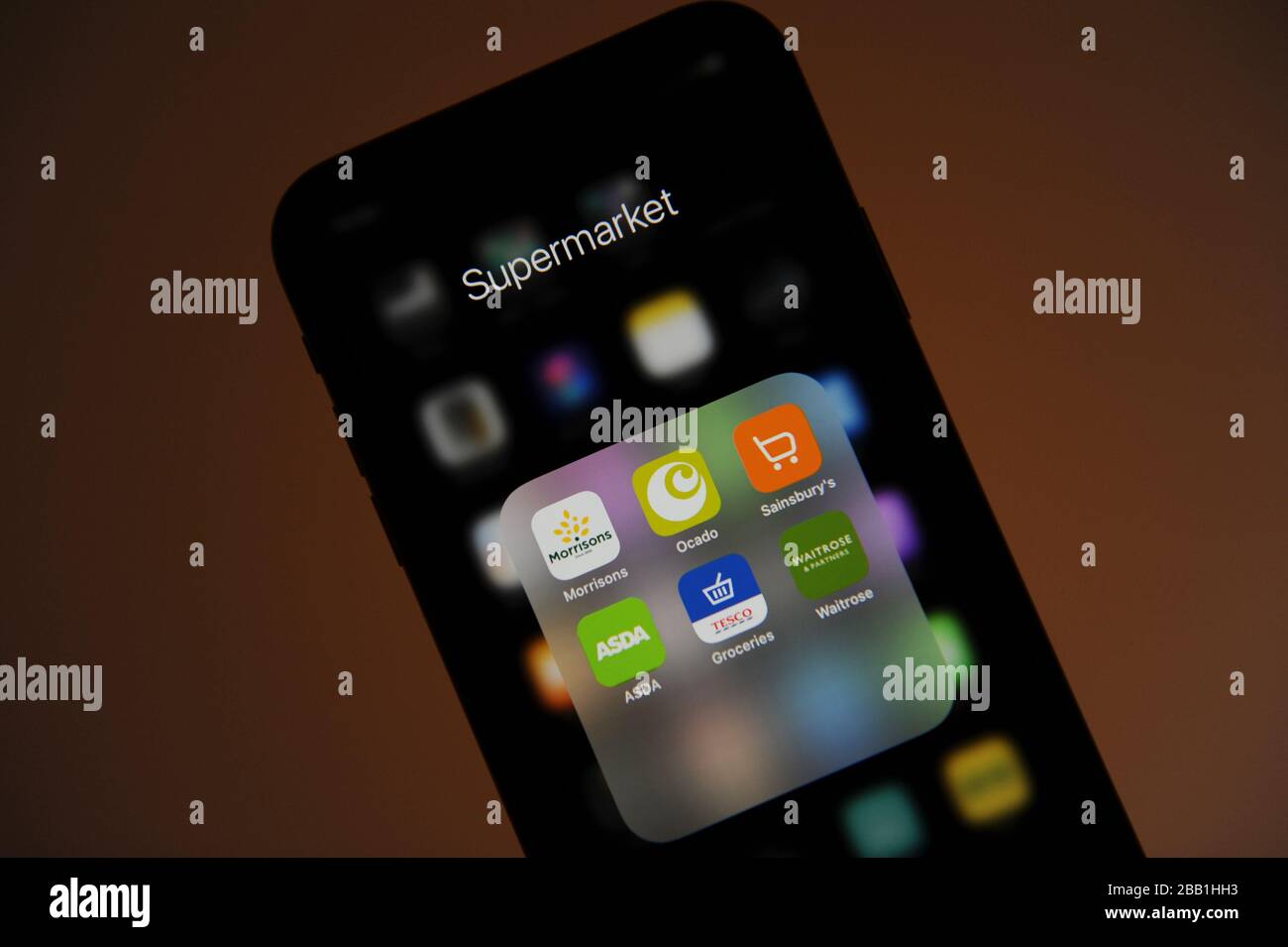 Generic UK Supermarket apps are seen on an iphone, from left to right ...