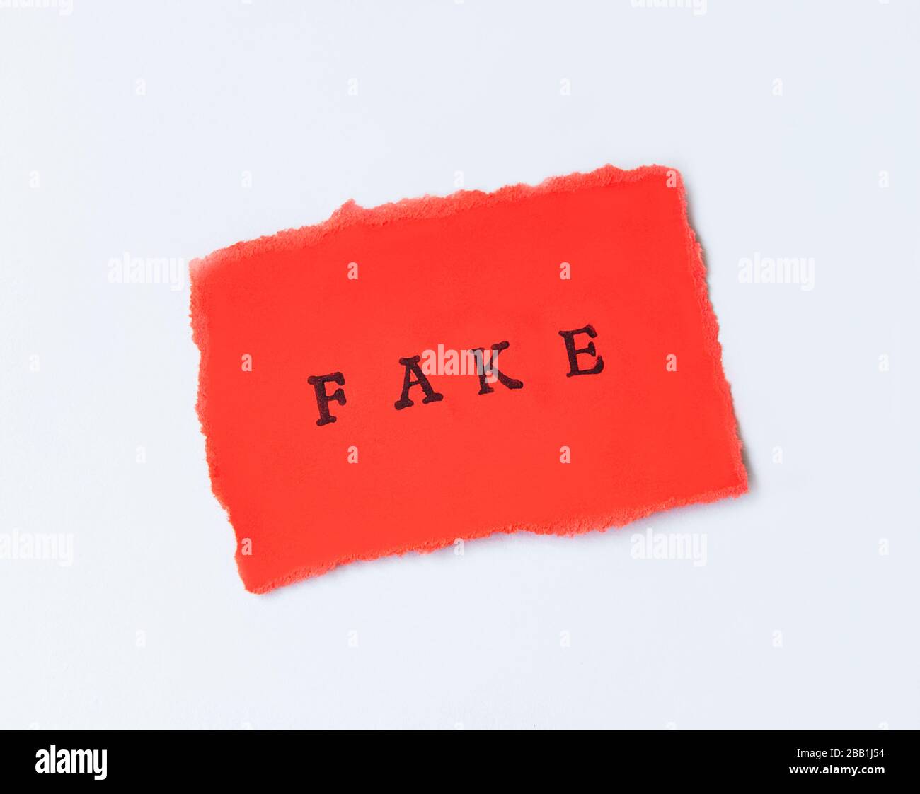 Word Fake written on torn paper. Flat lay, top view Stock Photo - Alamy