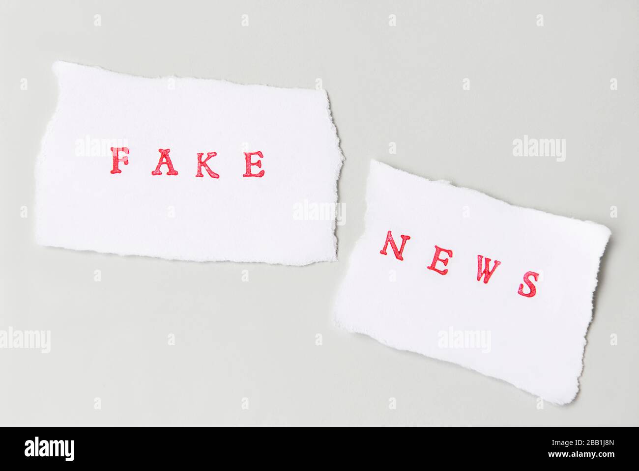 Words Fake News written on torn paper. Flat lay, top view Stock Photo ...