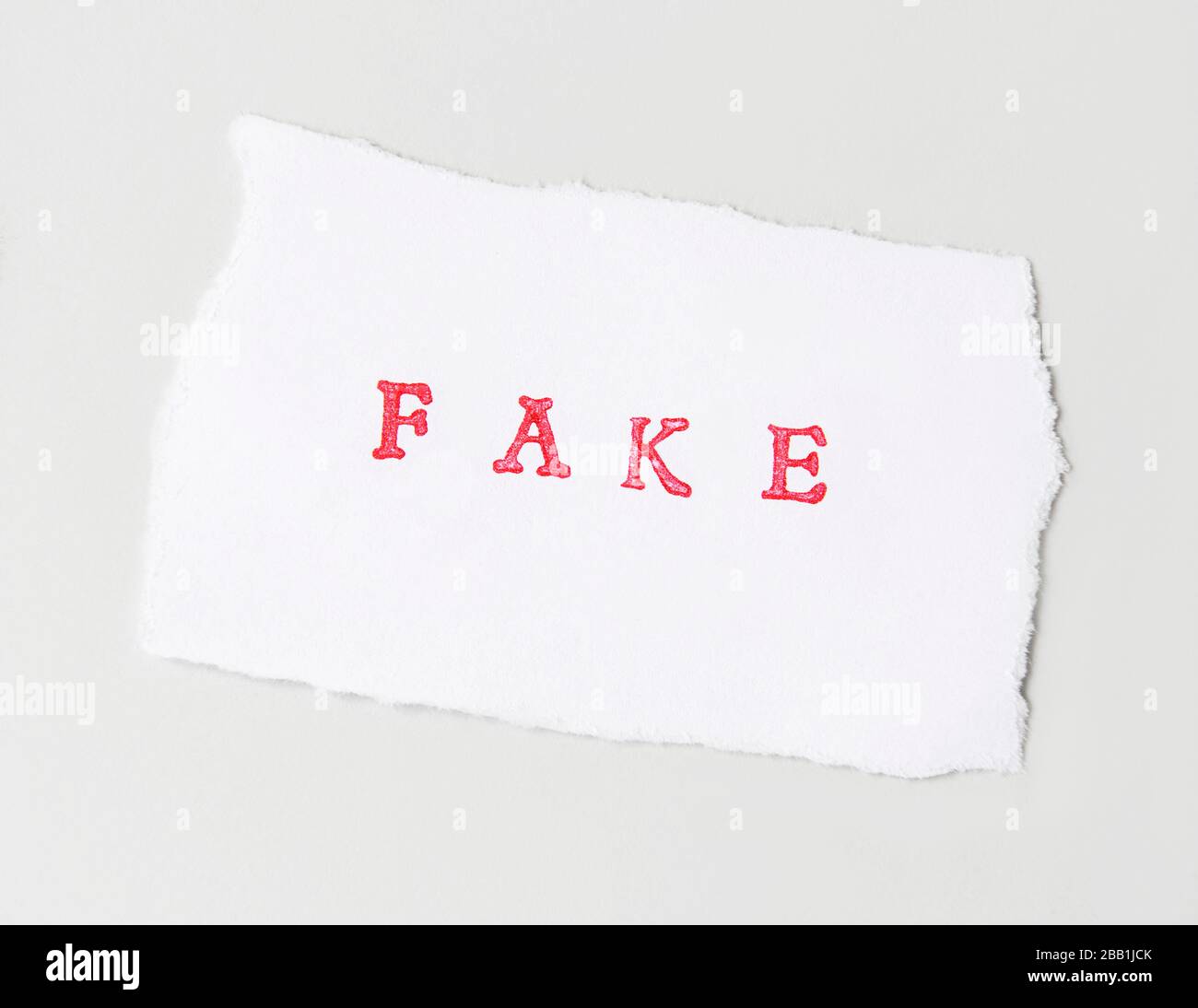 Word Fake written on torn paper. Flat lay, top view Stock Photo - Alamy