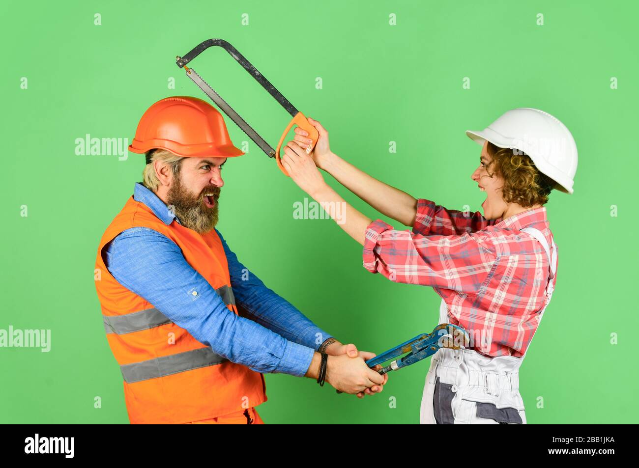 builder fighting. real estate deal. couple of architect wear hardhat ...