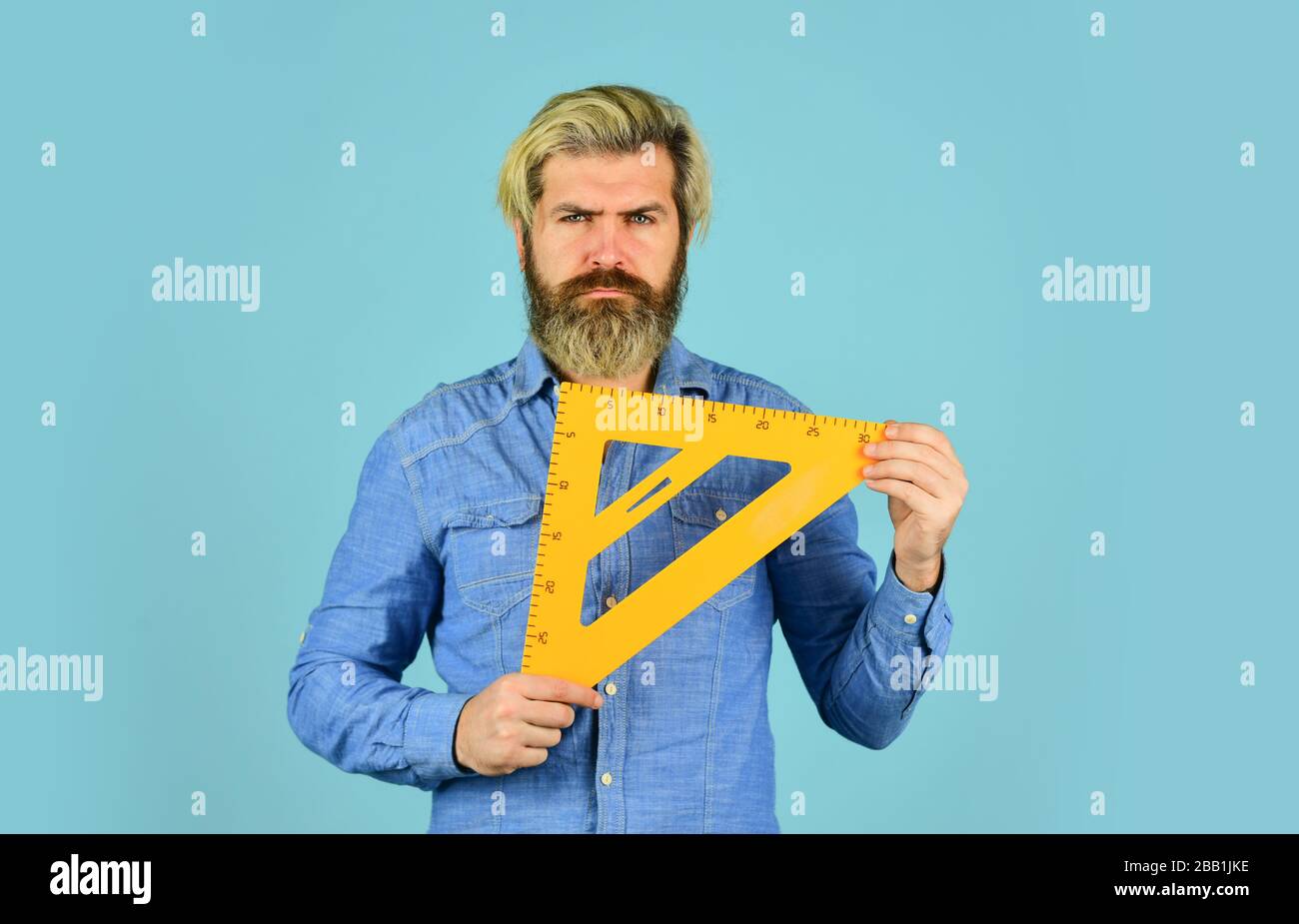 Education. man teacher use triangle tool. bearded tutor man with ruler ...