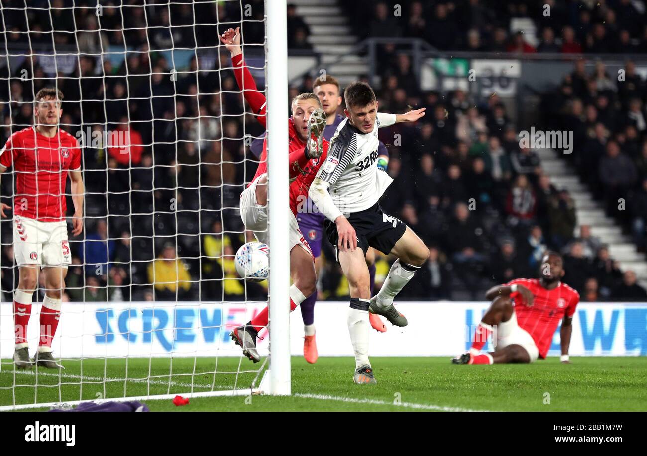 Derby County's Jason Knight (centre) scores his side's first goal of ...