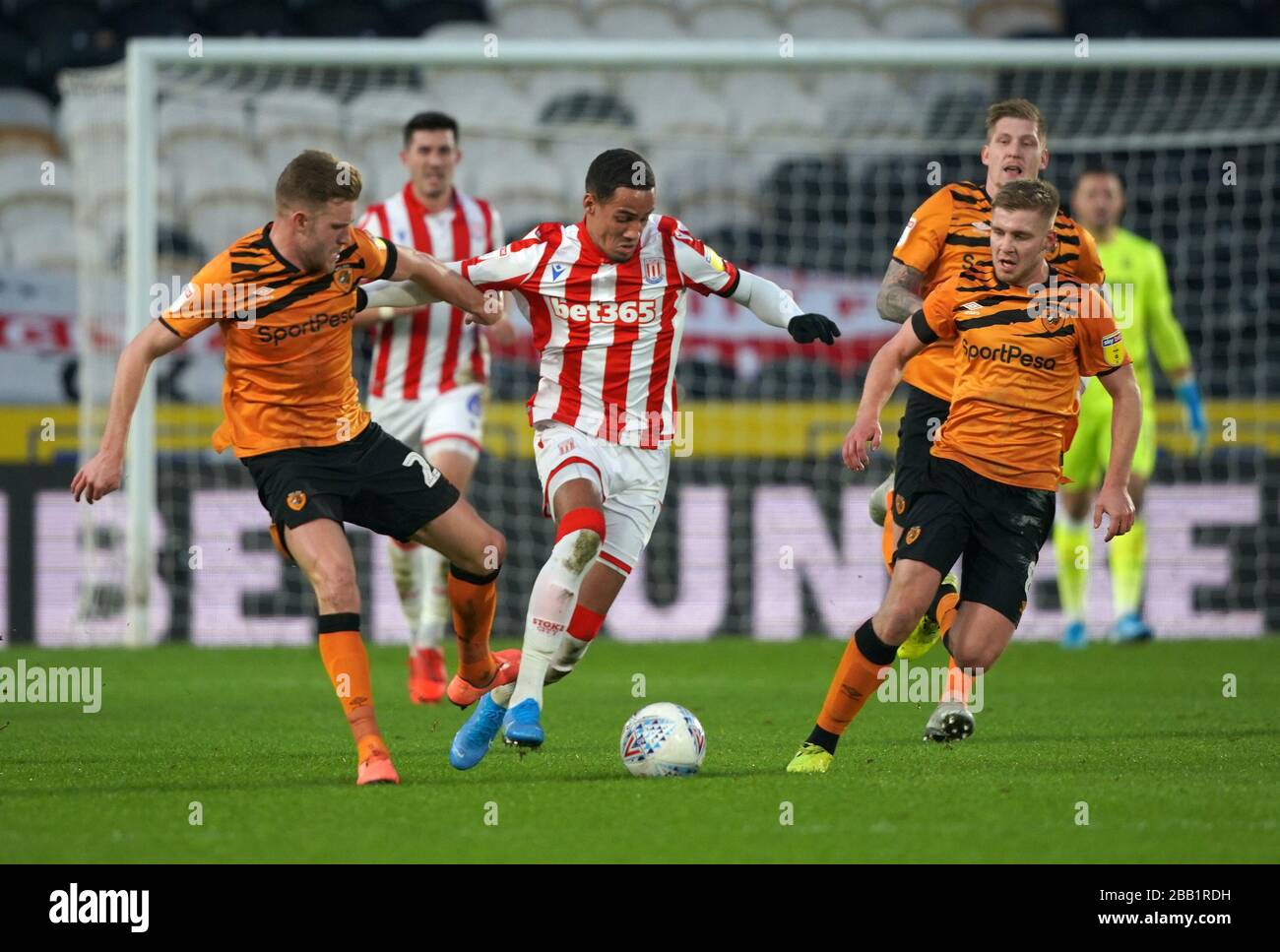 Stoke City's Tom Ince challenges Hull City's Callum Elder and Daniel ...