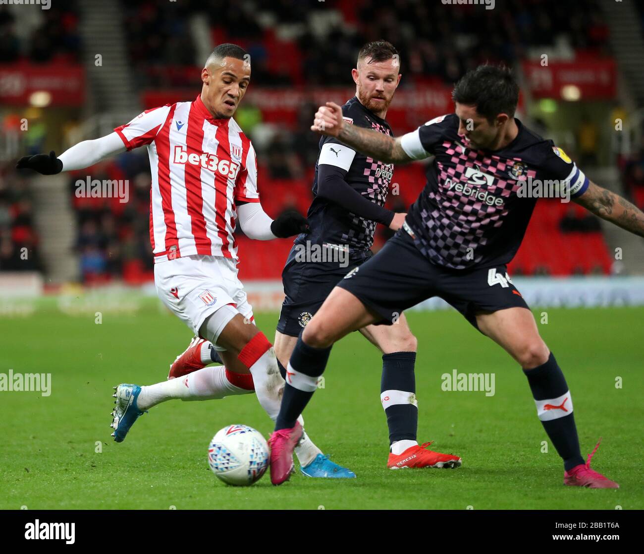 Stoke City's Tom Ince (left) and Luton Town's Alan Sheehan battle for ...