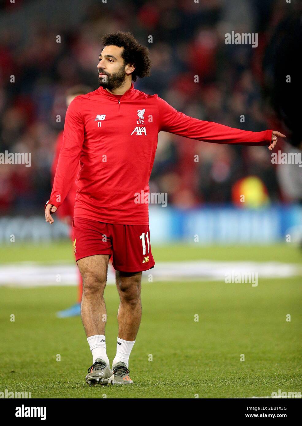 Liverpool's Mohamed Salah warms-up before kick-off Stock Photo - Alamy