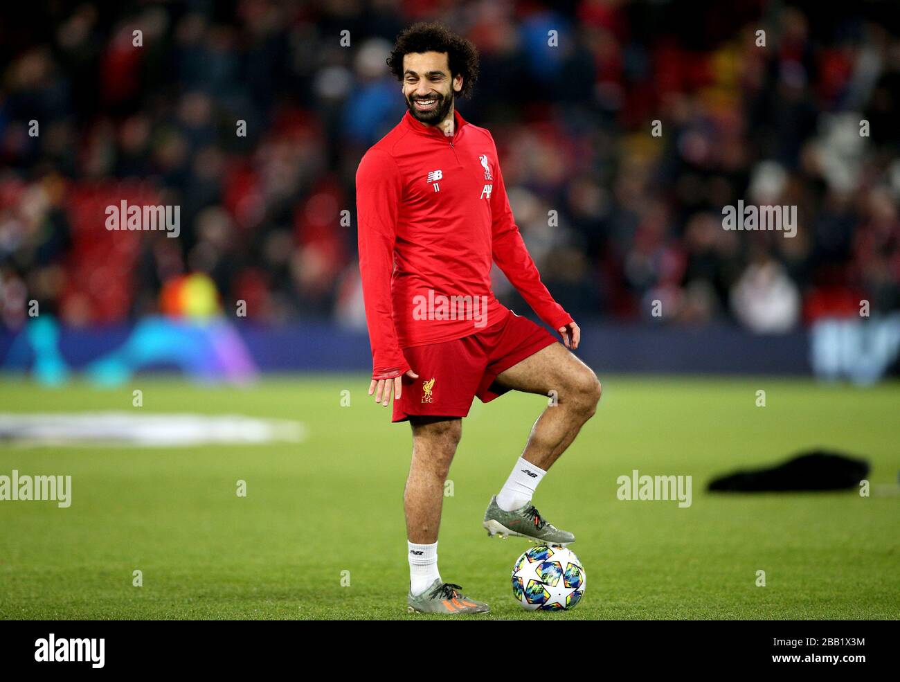 Liverpool's Mohamed Salah warms-up before kick-off Stock Photo - Alamy