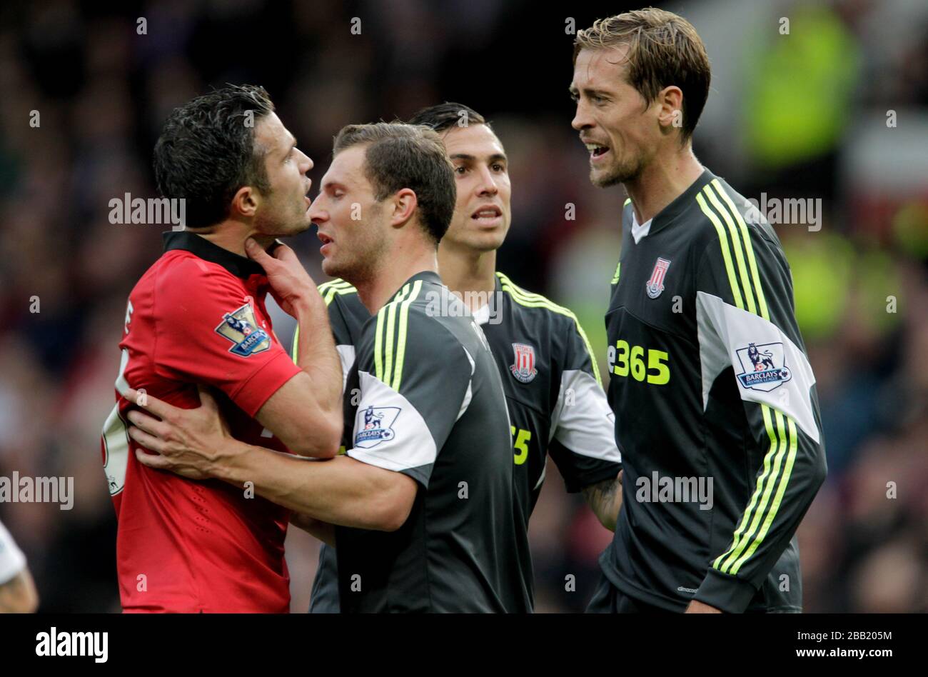 Manchester united's Robin van Persie argues with Stoke City's Erik ...