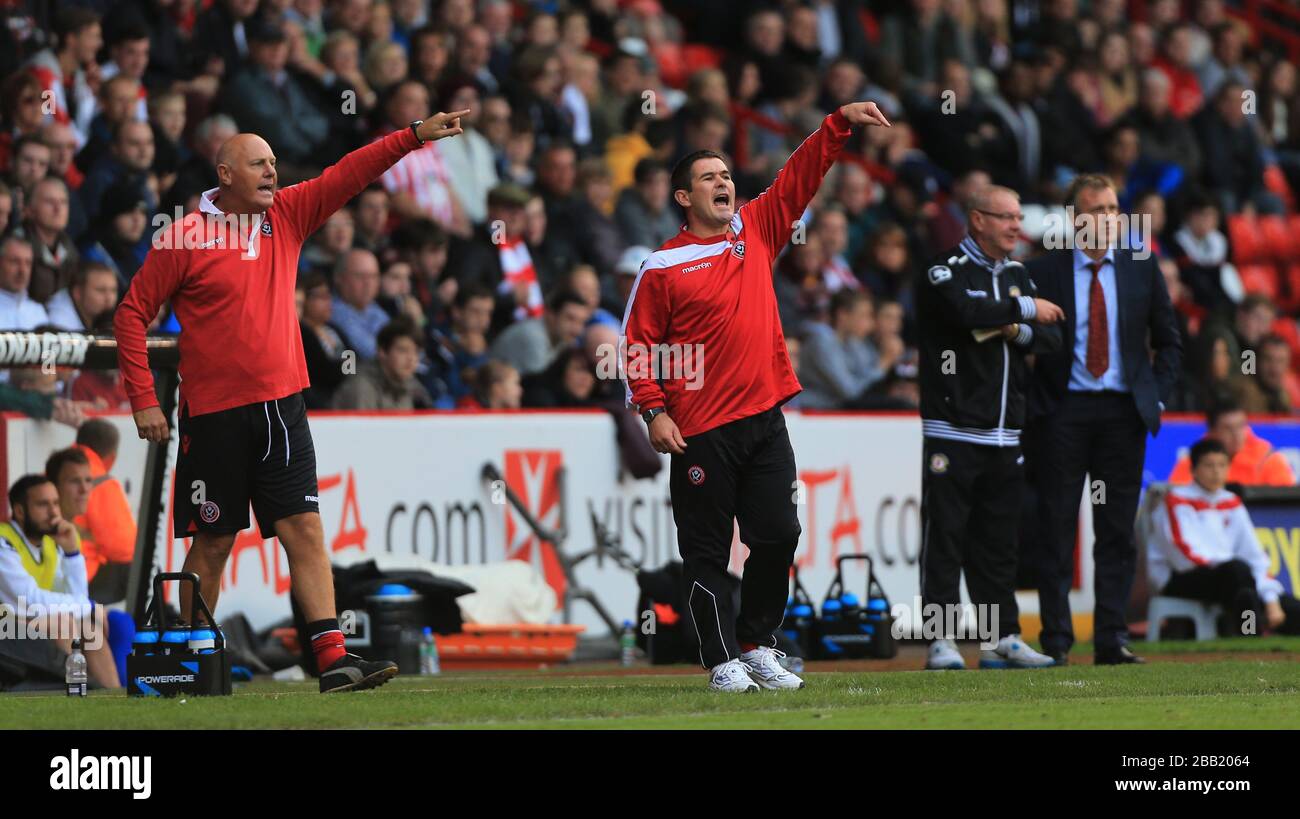 Sheffield United's New manager Nigel Clough (centre) on the touchline ...