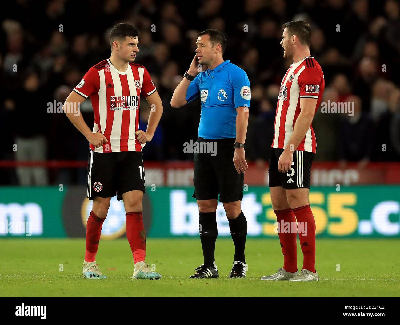 Referee Stuart Attwell (centre) in conversation with VAR over Newcastle ...