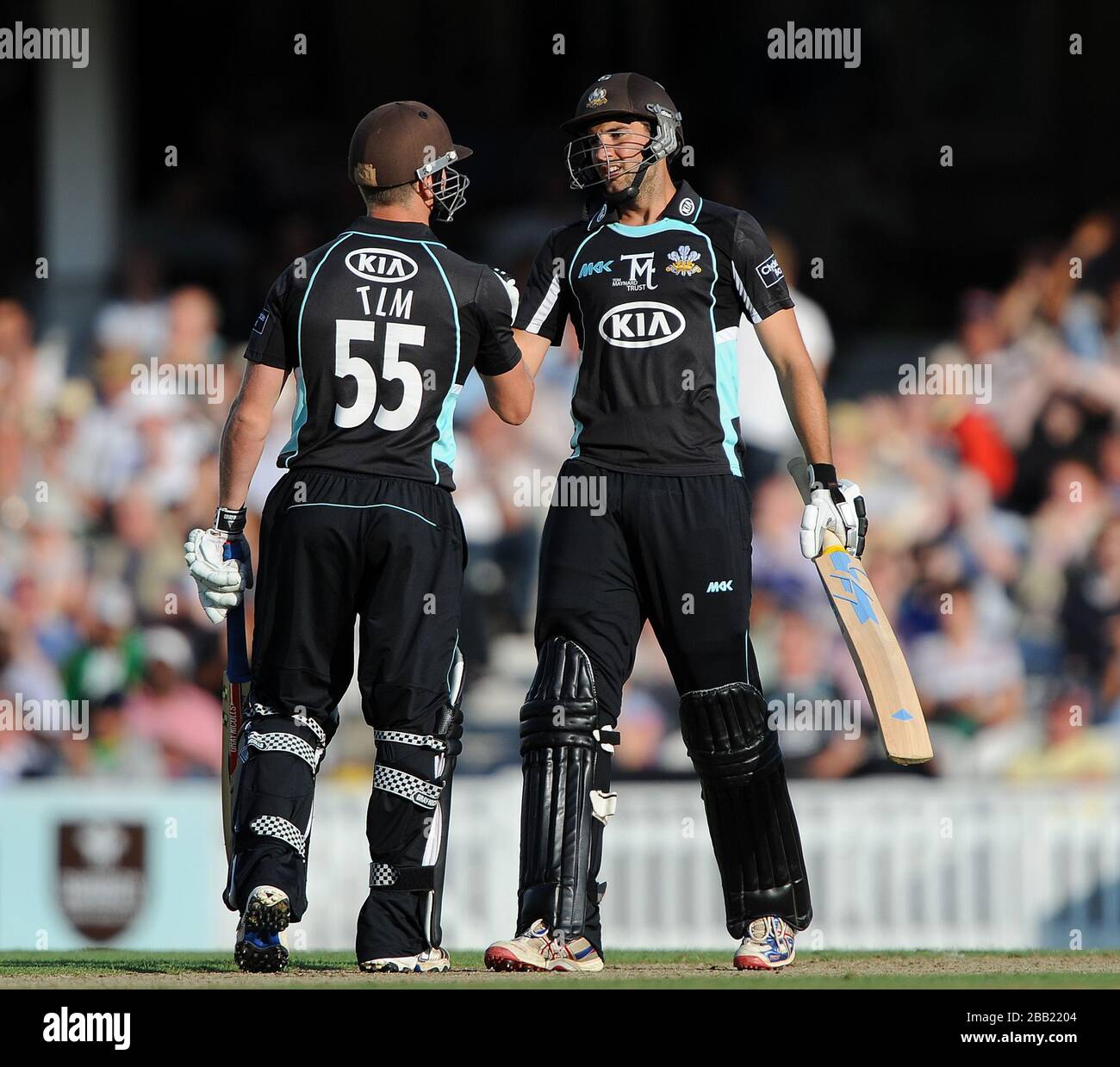 Surrey's Matthew Spriegel (right) is congratulated by Stuart Meaker ...