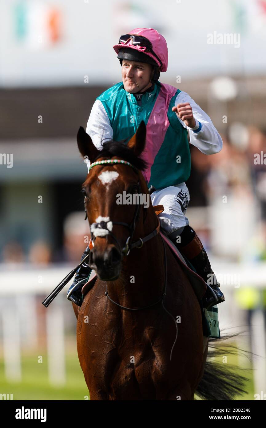 Tom Queally onboard Frankel celebrates on his parade past the ...