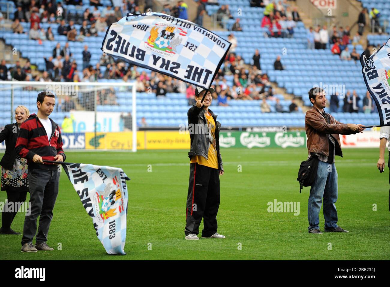 Fans wave Coventry City flags before kick off Stock Photo - Alamy