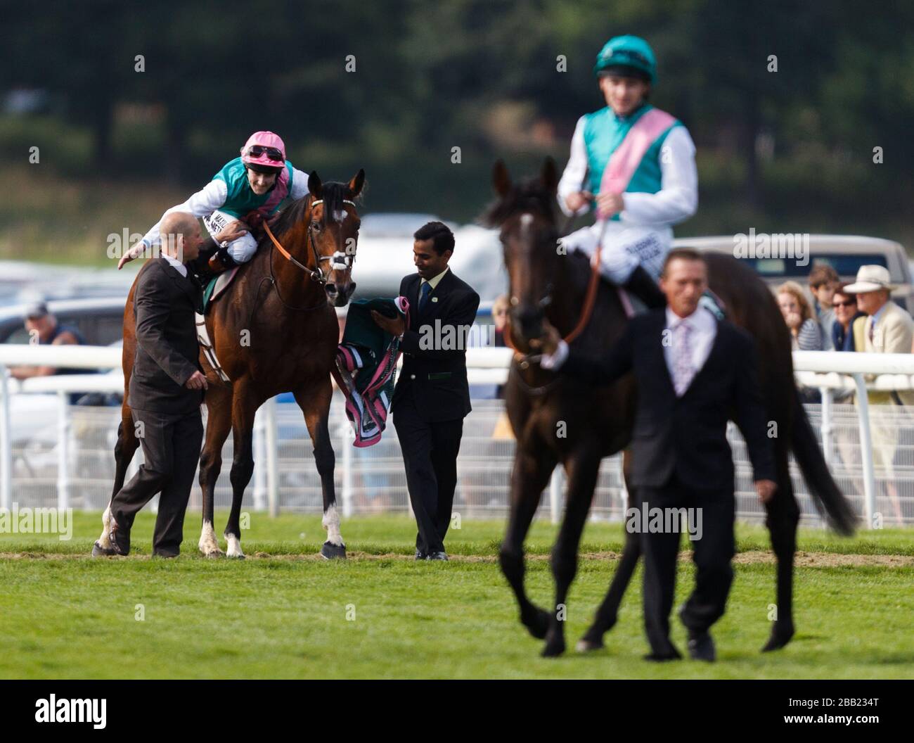 Tom Queally onboard Frankel celebrates on his parade past the ...