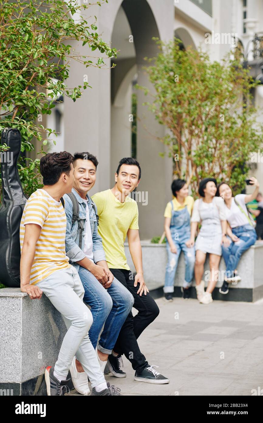 Positive students discussing homework hi-res stock photography and ...